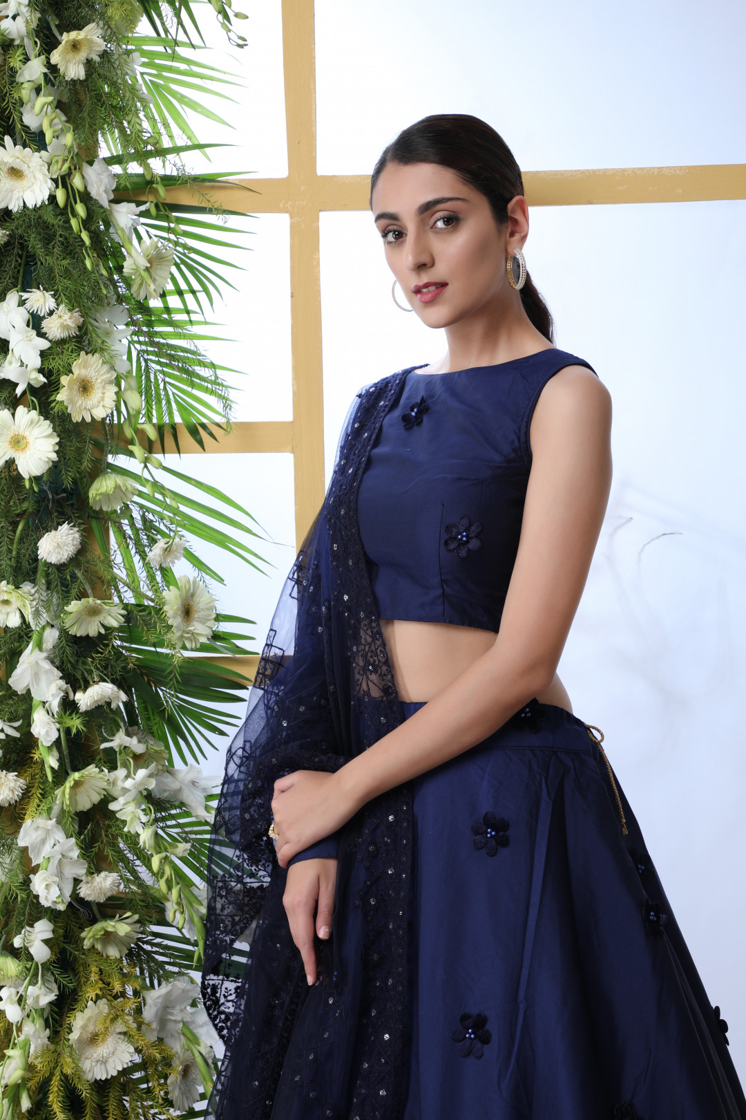 Navy blue color taffeta silk lehenga with flower pasting design