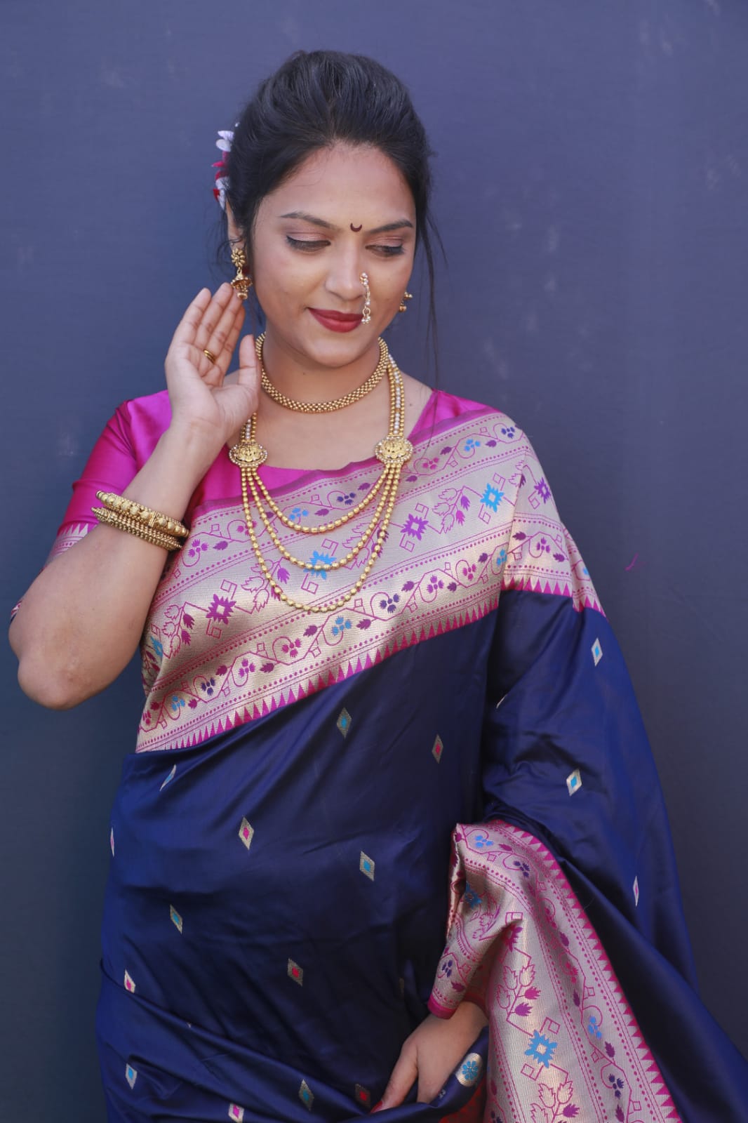 Navy blue color paithani silk saree with golden zari work