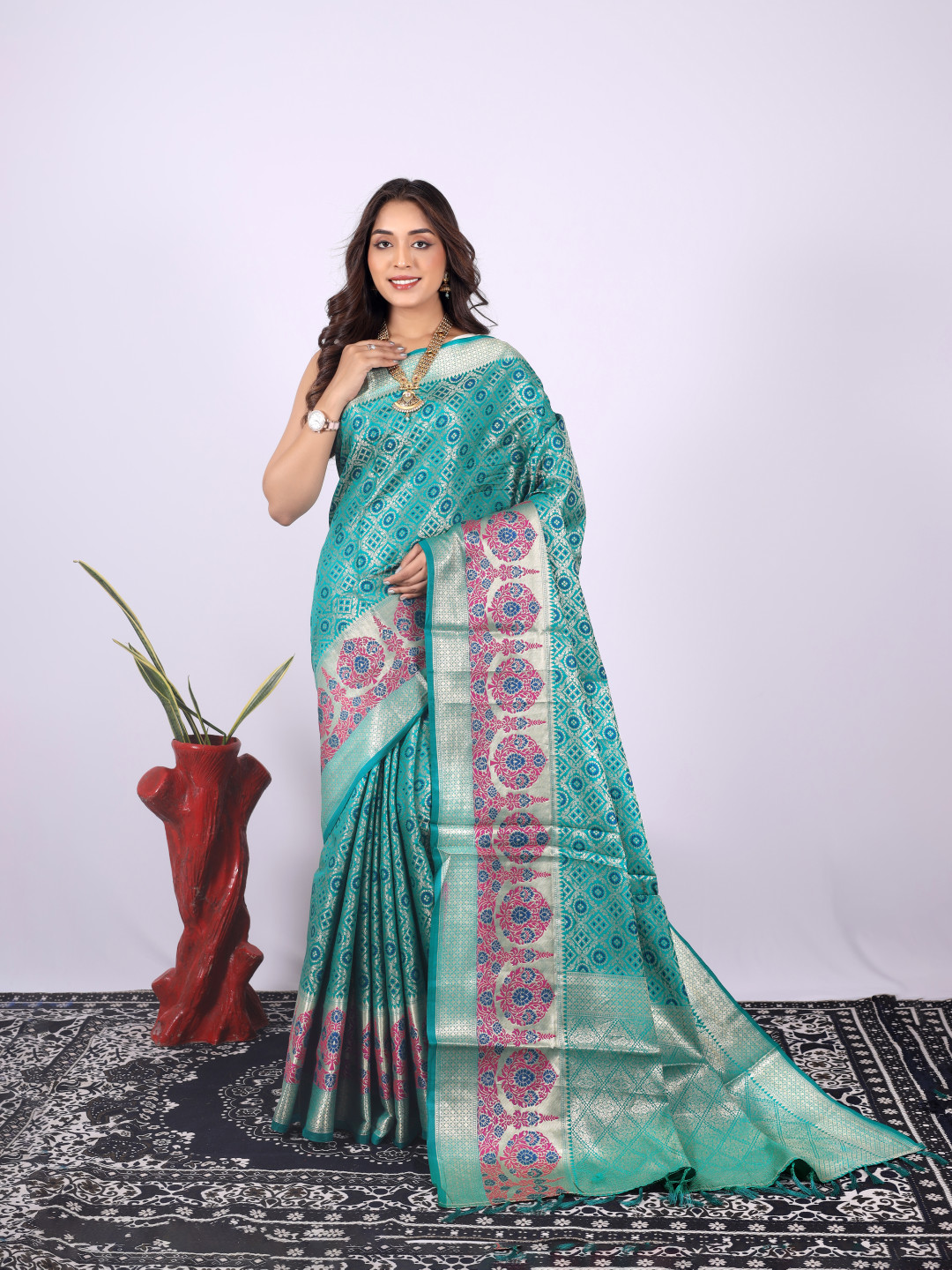 Rama green color patola silk saree with woven design