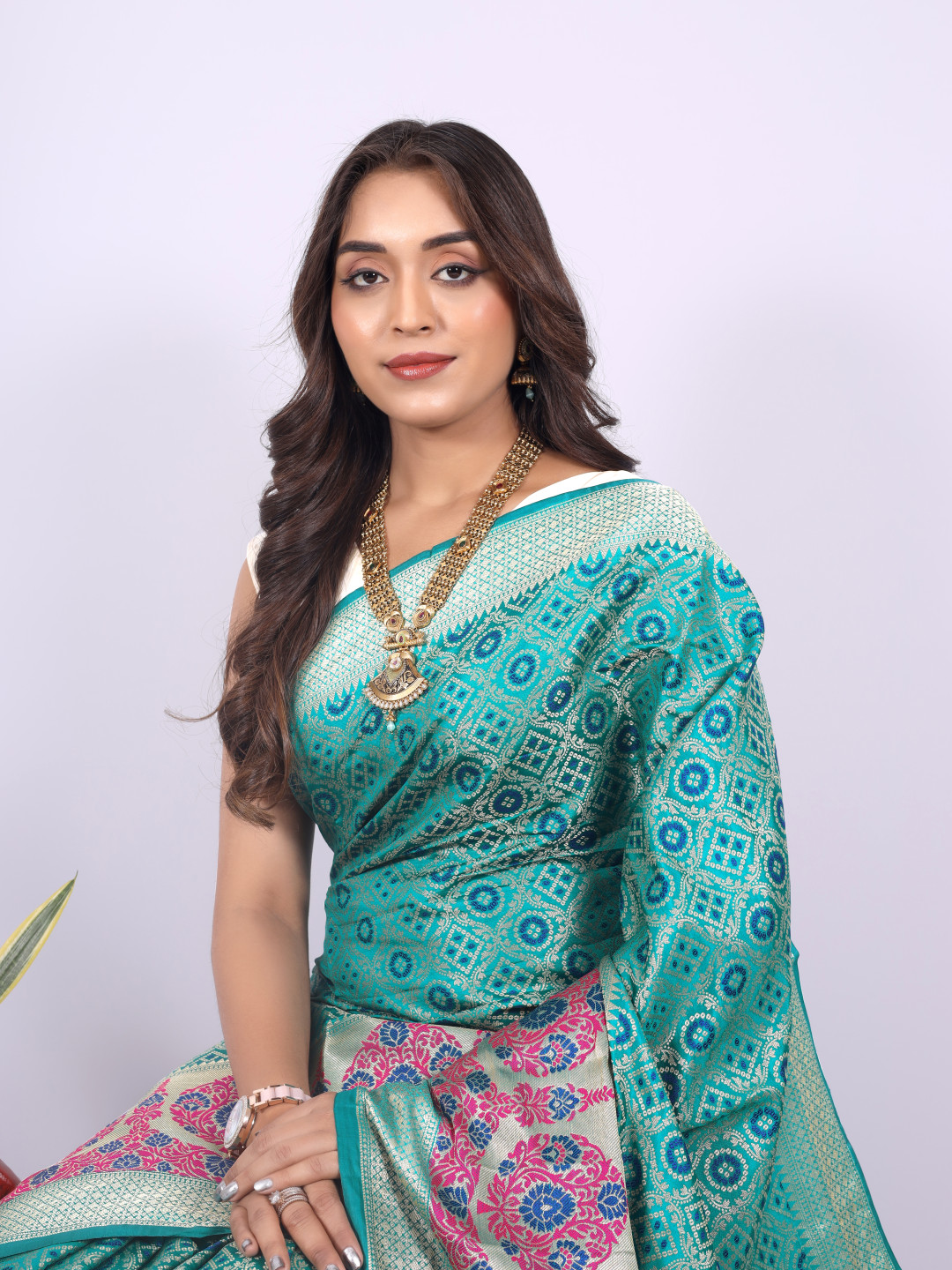 Rama green color patola silk saree with woven design