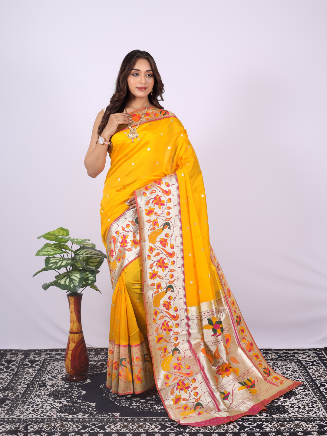 Yellow color paithani silk saree with zari woven work
