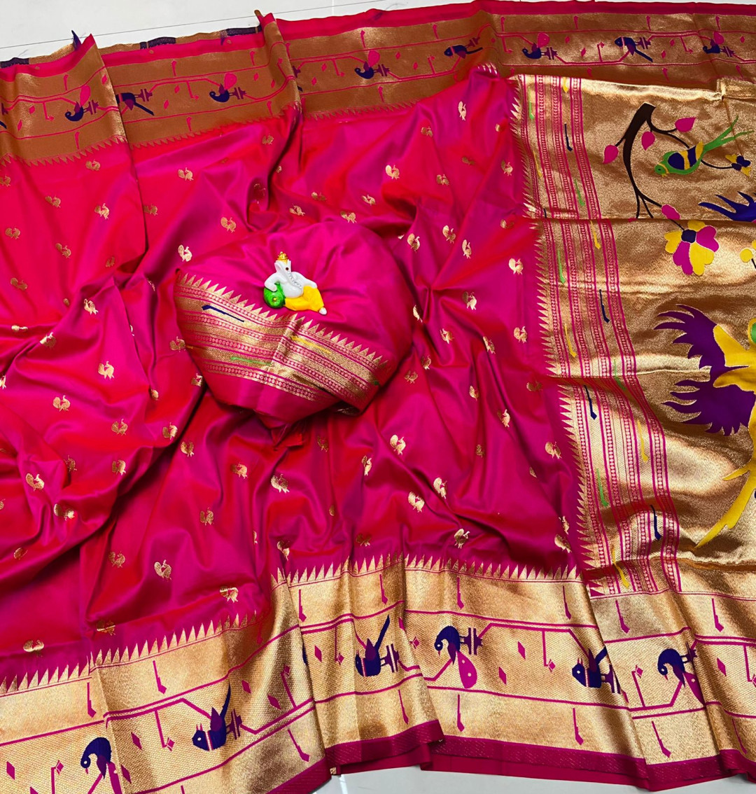 Rani pink color paithani silk saree with zari weaving work