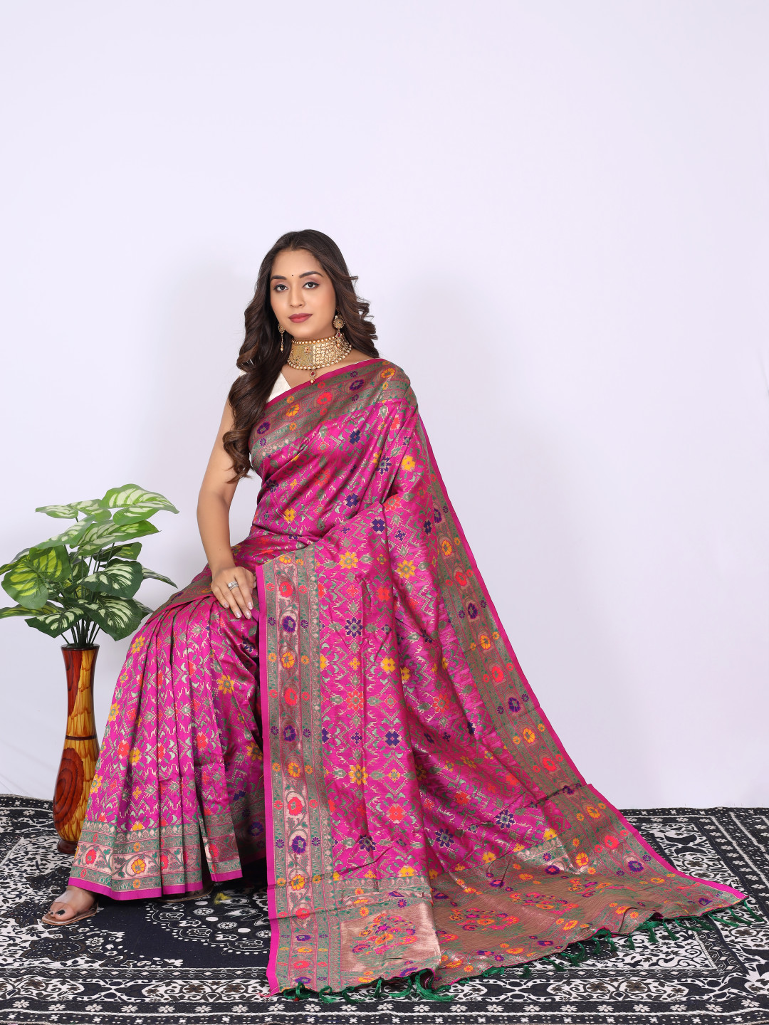 Rani pink color patola silk saree with woven design