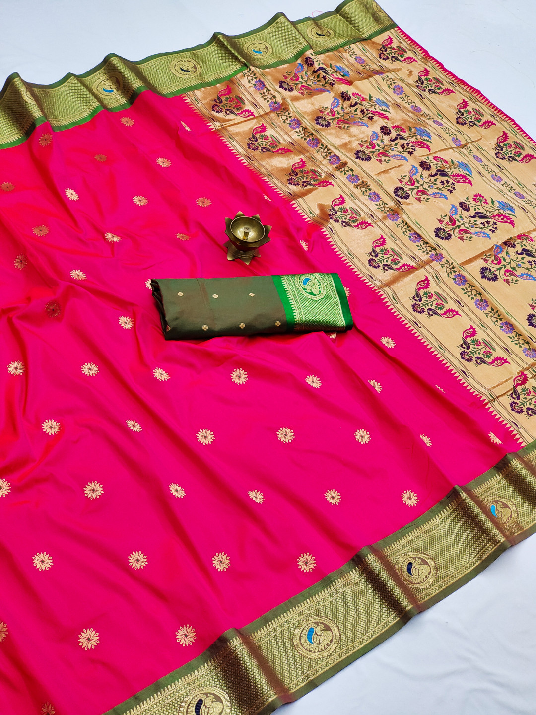 Rani pink color paithani silk saree with zari weaving work