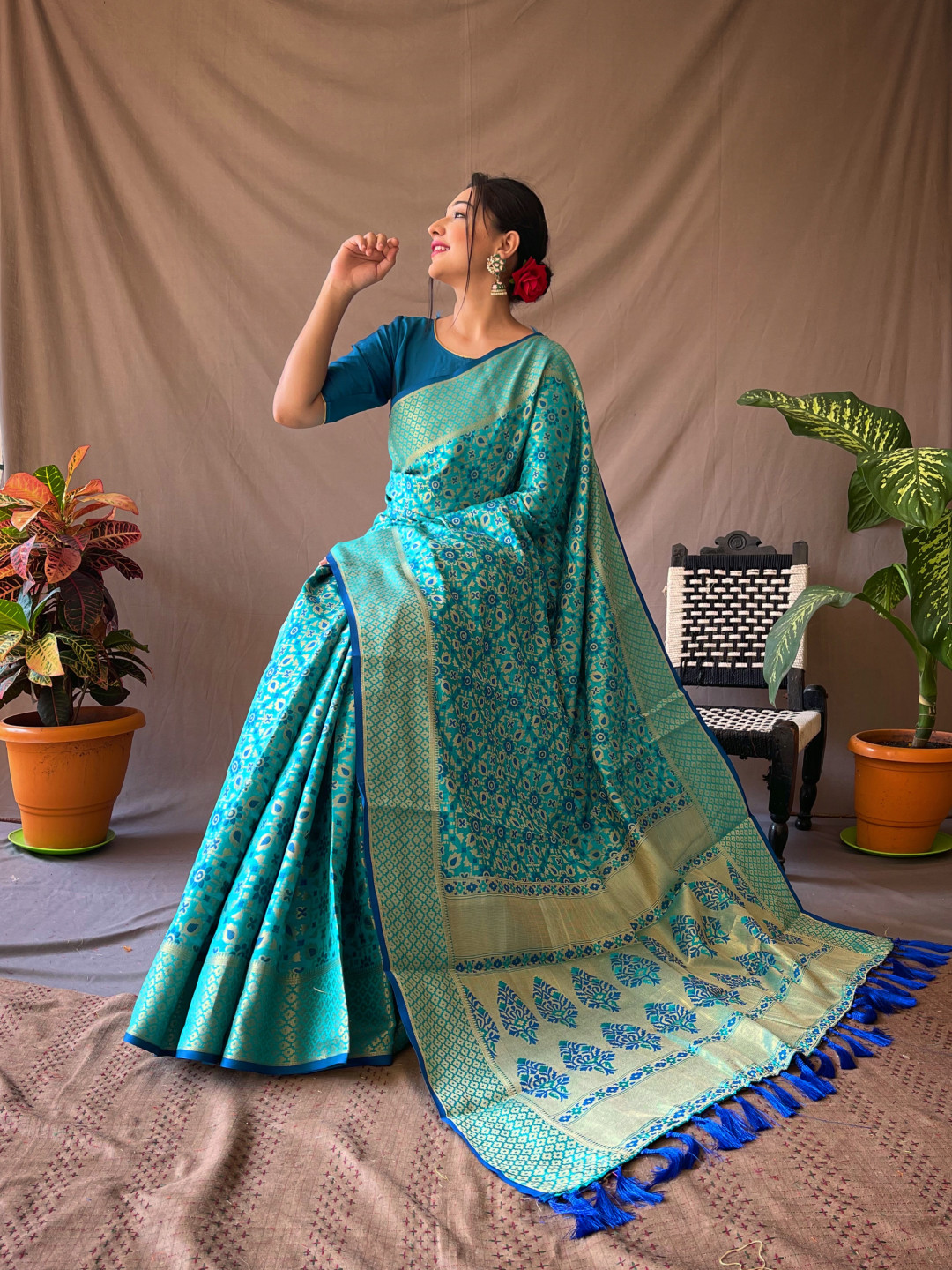 Rama green color patola silk saree with zari weaving work