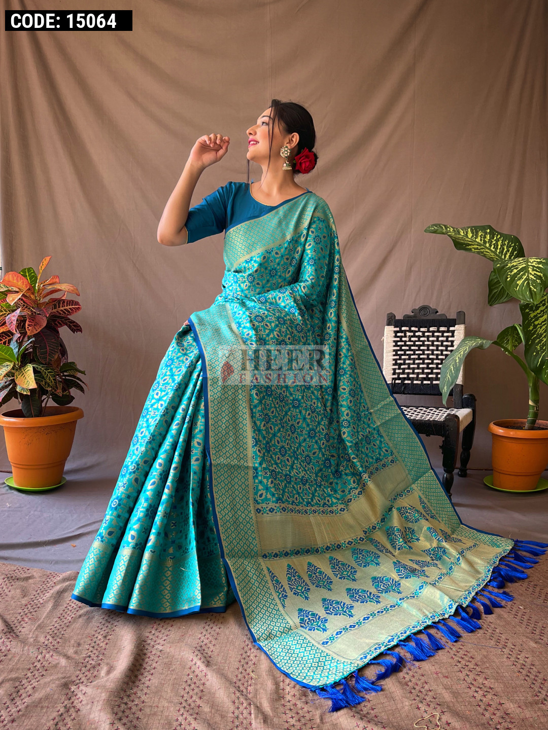 Rama green color patola silk saree with zari weaving work