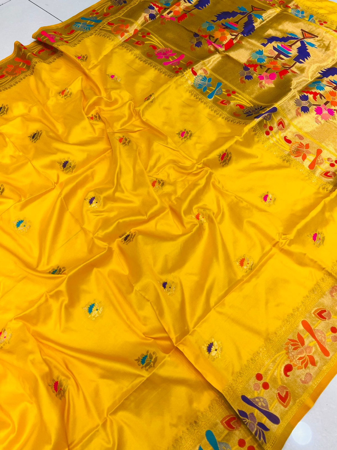 Yellow color paithani silk saree with golden zari weaving work