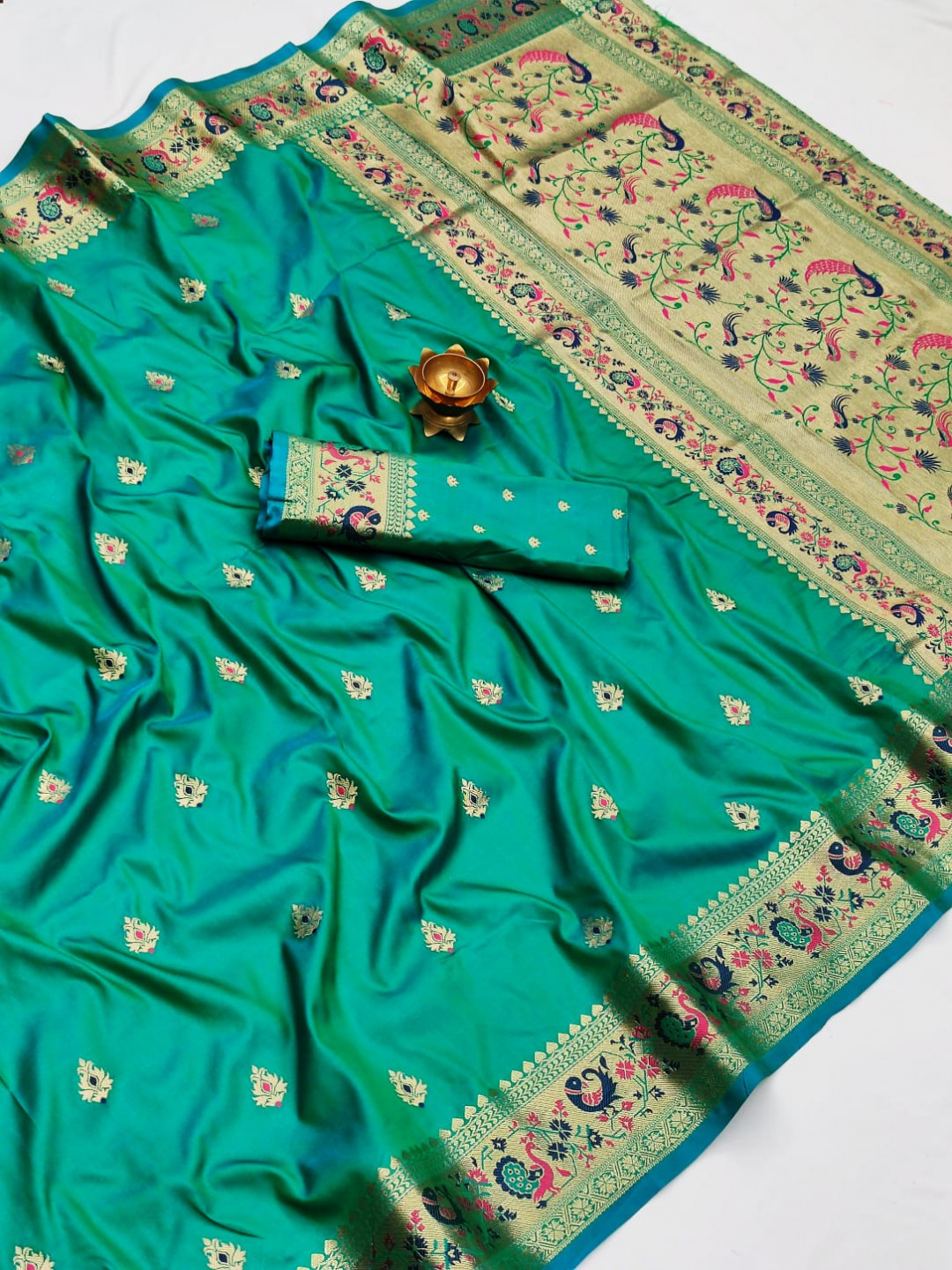 Rama green color paithani silk saree with zari weaving work