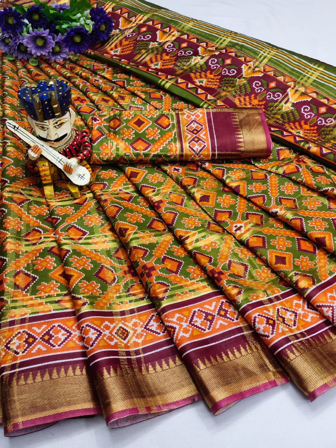 Mehandi green color soft cotton saree with patola printed work