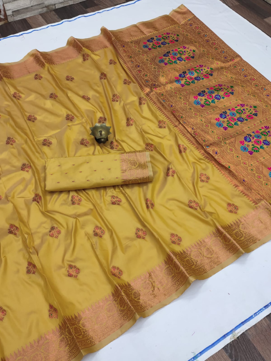 Yellow color paithani silk saree with zari weaving work